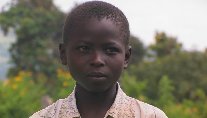 KENYA, AFRICA - CIRCA 2009: A Young African Boy With A Serious ... KENYA, AFRICA - CIRCA 2009: A Young African Boy With A Serious ...