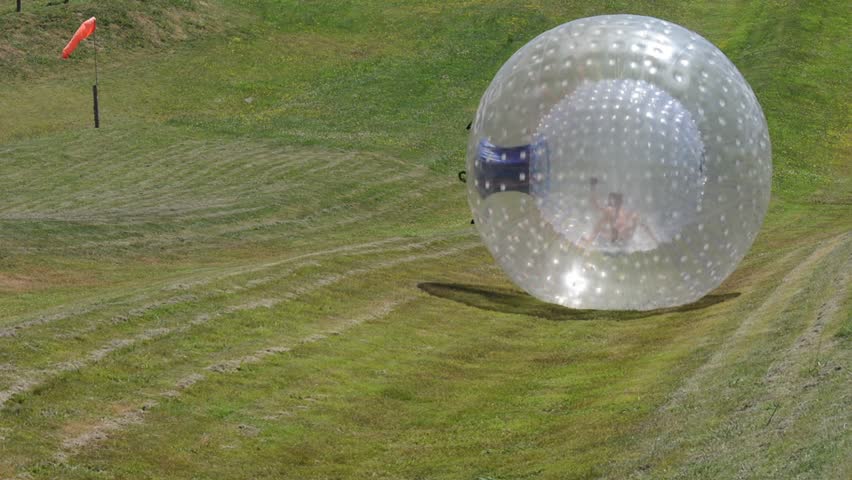 ROTORUA, NZL - JAN 18 2015:Visitor Rides In Ball Rolling OGO Zorbing ... ROTORUA, NZL - JAN 18 2015:Visitor Rides In Ball Rolling OGO Zorbing ...