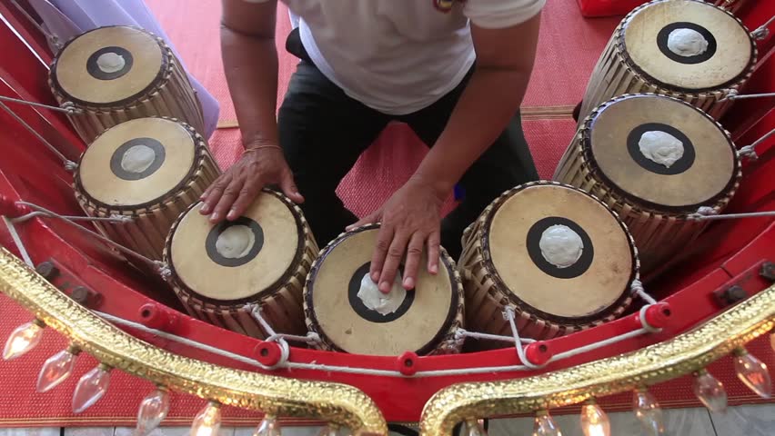 A Man Hit The Gong Ancient Drums With Thai Musical Instrument. Stock ...