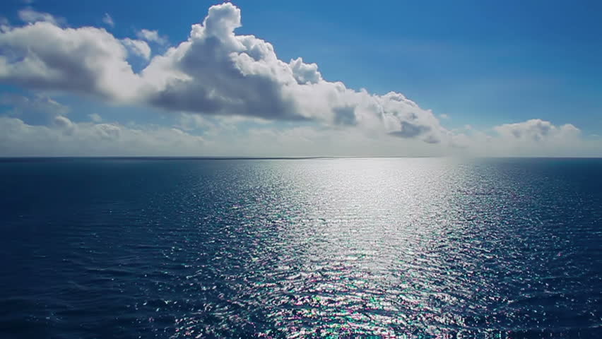 Shot Of The Sun Shining On The Ocean. This Clip Features The Shimmering ...