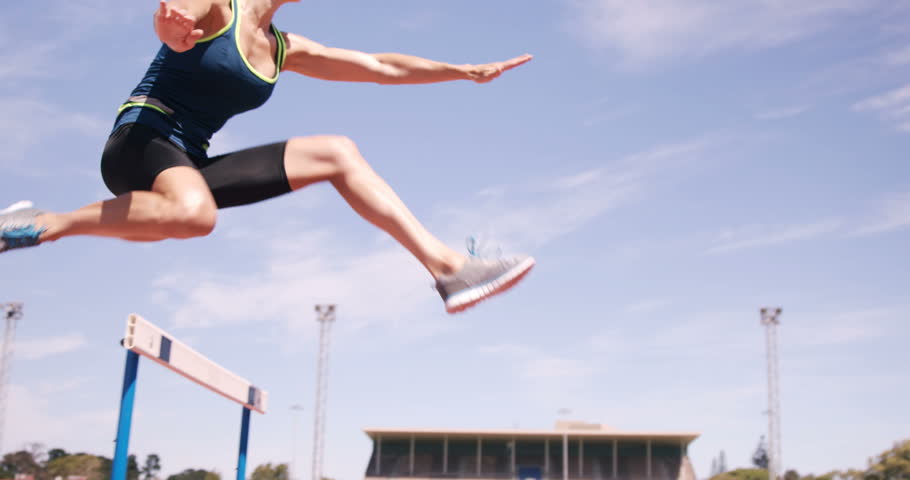 Track Athlete Jumps Over Hurdle, Slow Motion Stock Footage Video ...