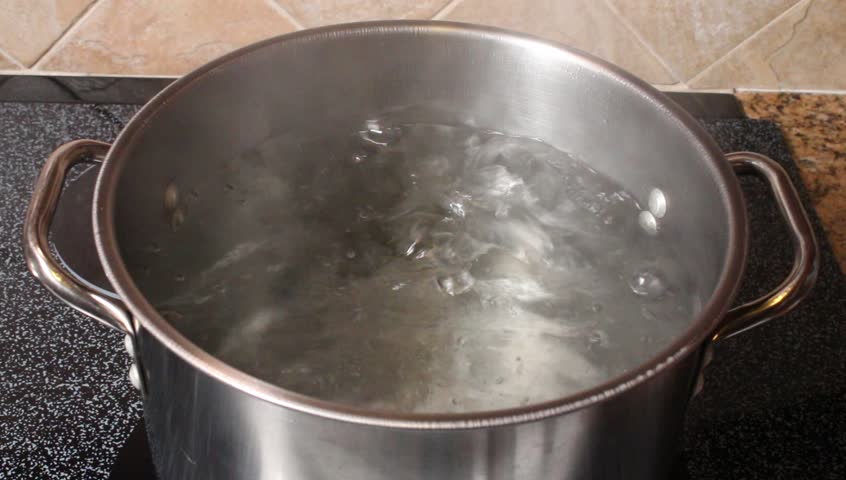 A Pot Of Boiling Water On The Stove (rapid Boil With Steam) Stock ...