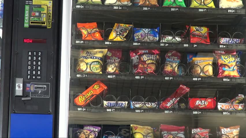 DALLAS, TX - FEB 23: Buying Potato Chip Crisps From Vending Machine On ...