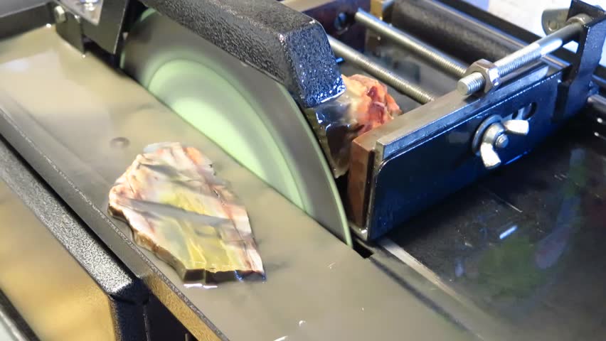 Lapidary Rock Saw Cutting A Slab Of Petrified Wood On Auto Feed With ...