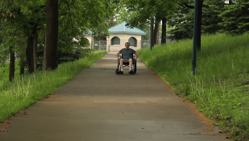 Senior Man In A Wheelchair Going Down A Ramp Stock Footage Video ...