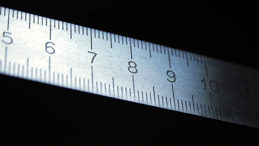 Metal Ruler On Black Background. The Movement Of Metal Ruler. Closeup ...