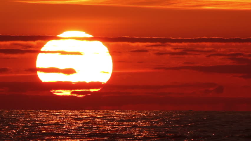 An Iconic Sunset Over Sea With A Great, Tele Shot Sun Falling From A ...