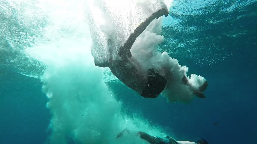 Two Young Men Jumping Into Deep Blue Sea Water Ocean Tropical Location ...