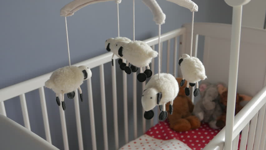 Lamb Nursery Mobile Spinning Above Baby Crib, Close-Up Stock Footage ...