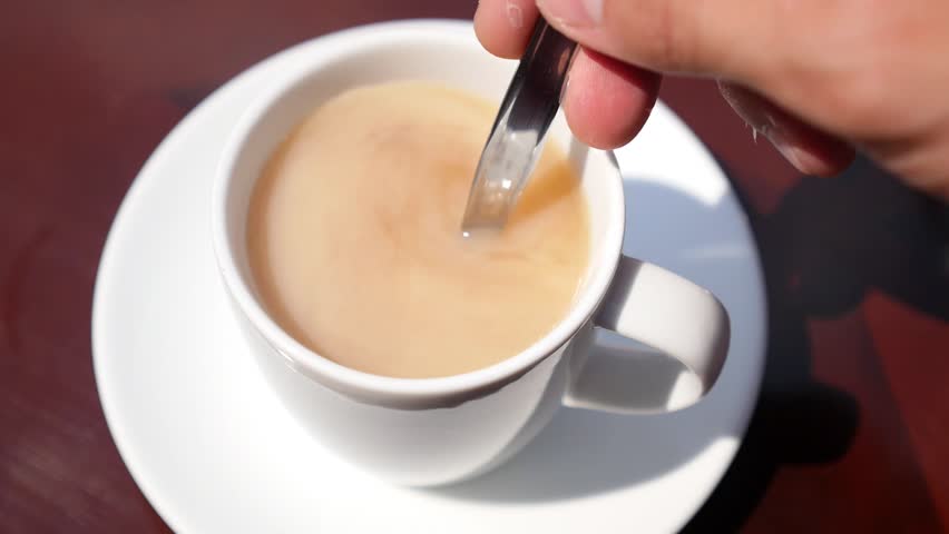 Male Hand Stirs Steaming Cup Of Tea Outdoors. Slow Motion. HD ...