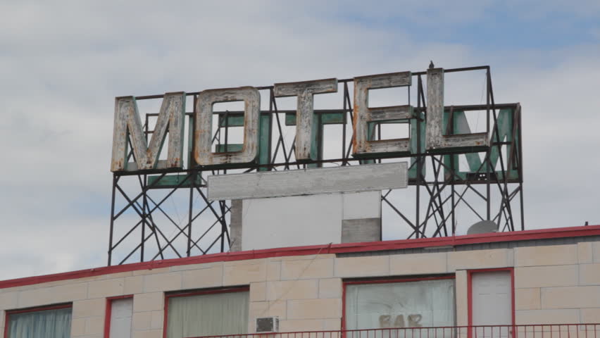 Motel Sign. Big Sign On Top Of Cheap Motel. Pigeons Landing. Stock ...