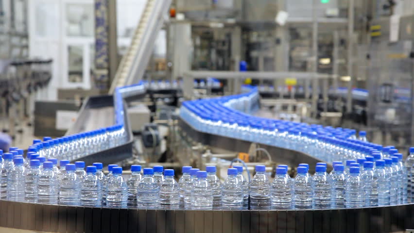 Production of clean water. Water bottle conveyor industry. - HD stock ...